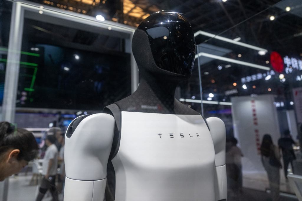 Elon Musk Reveals Tesla Optimus Robots, Remotely Controlled